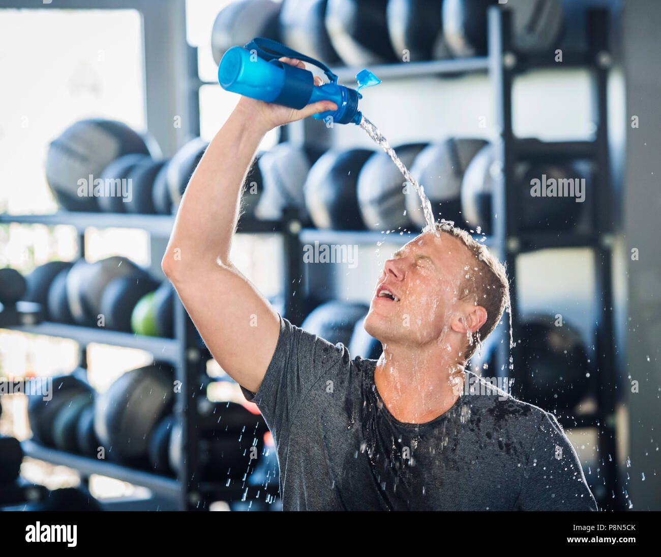 Man pouring water on himself hi-res stock photography and images - Alamy