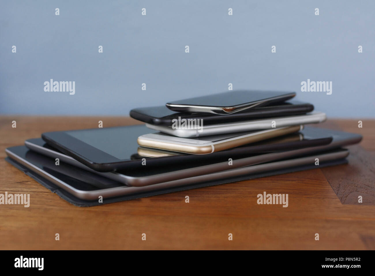 Stack of smart phones and digital tablets Stock Photo - Alamy