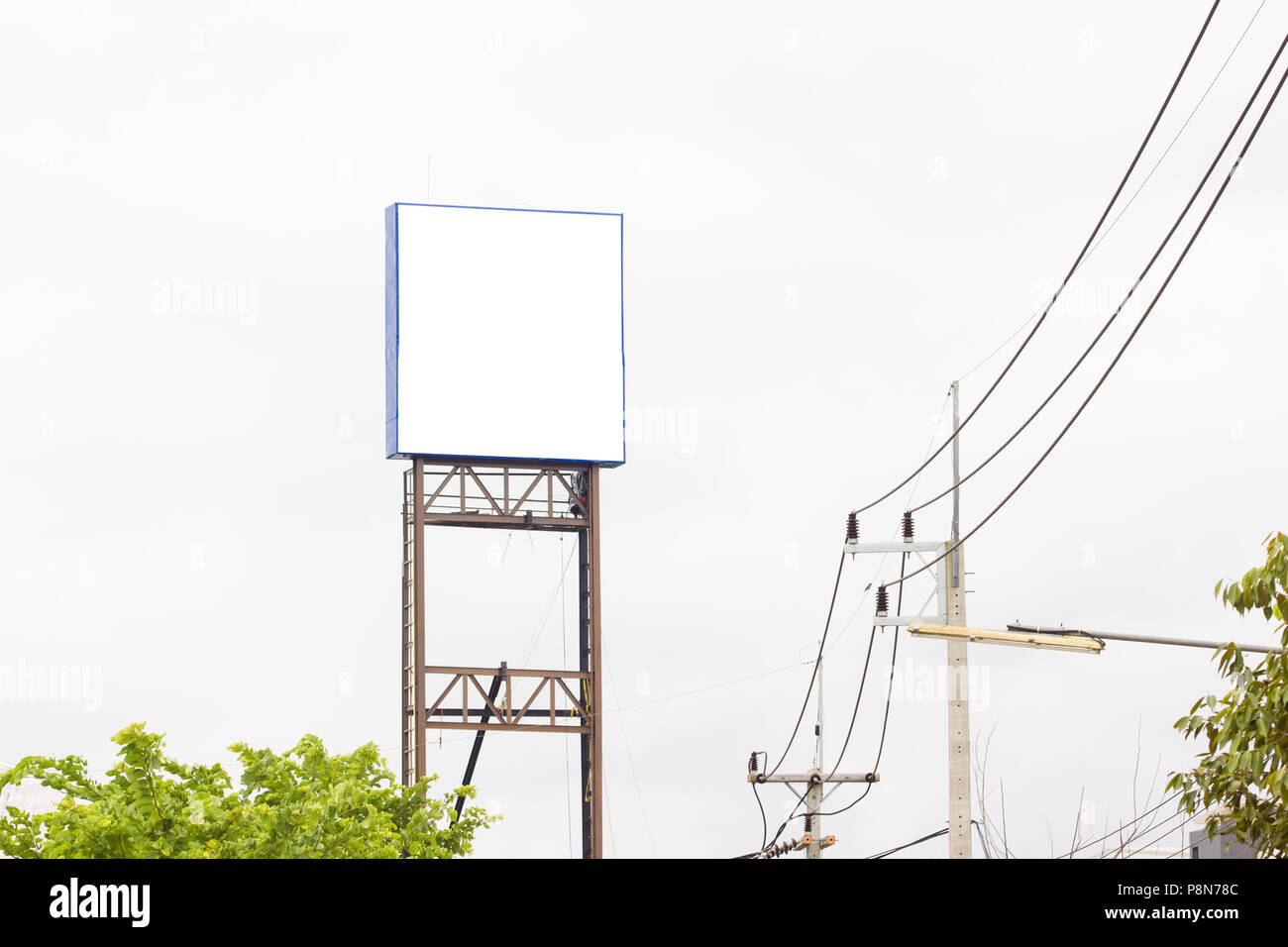 Blank billboard mockup outdoor canvas on sky background with tree and ...