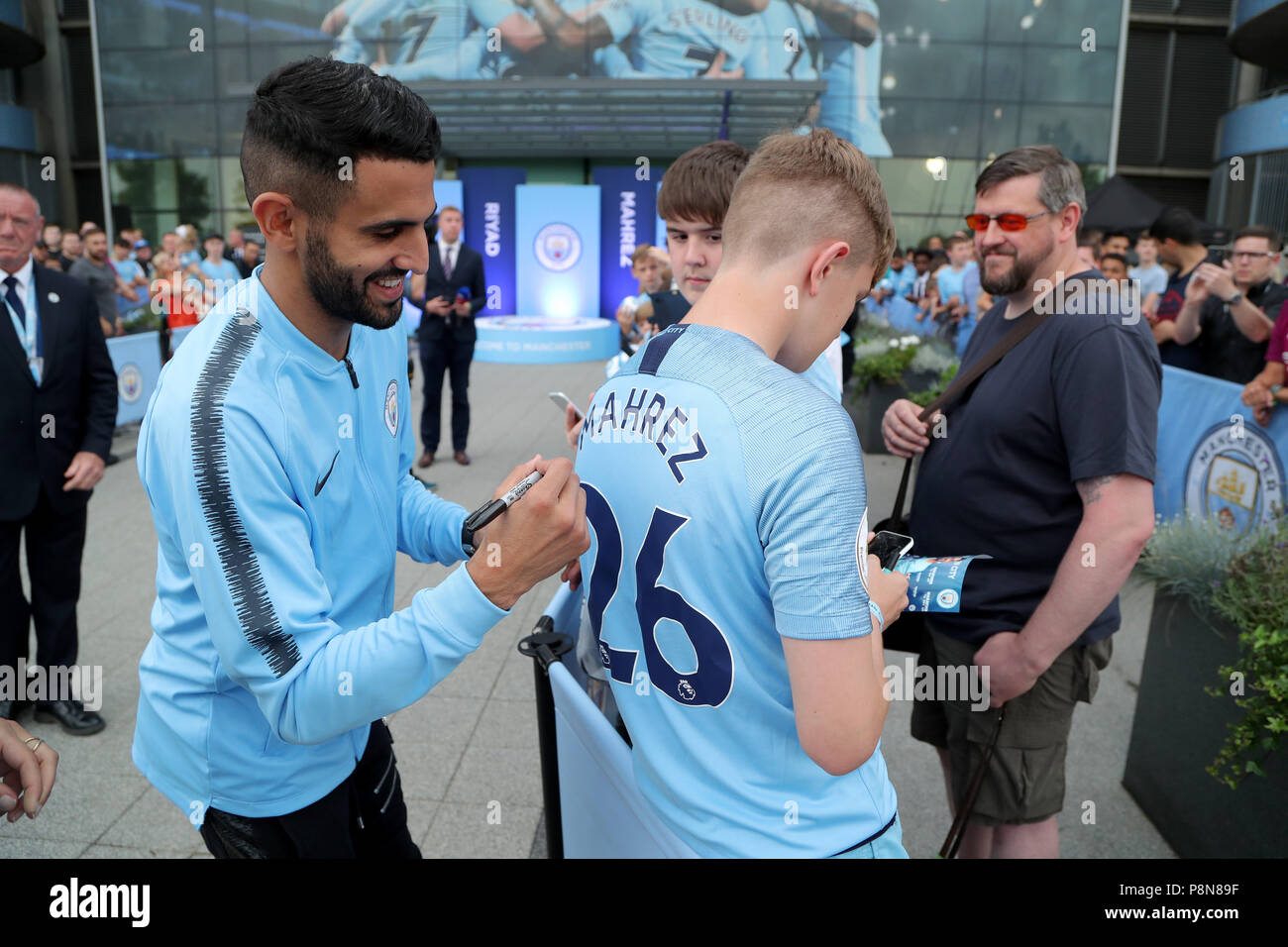 New Manchester City signing Riyad Mahrez greets and signs autographs ...
