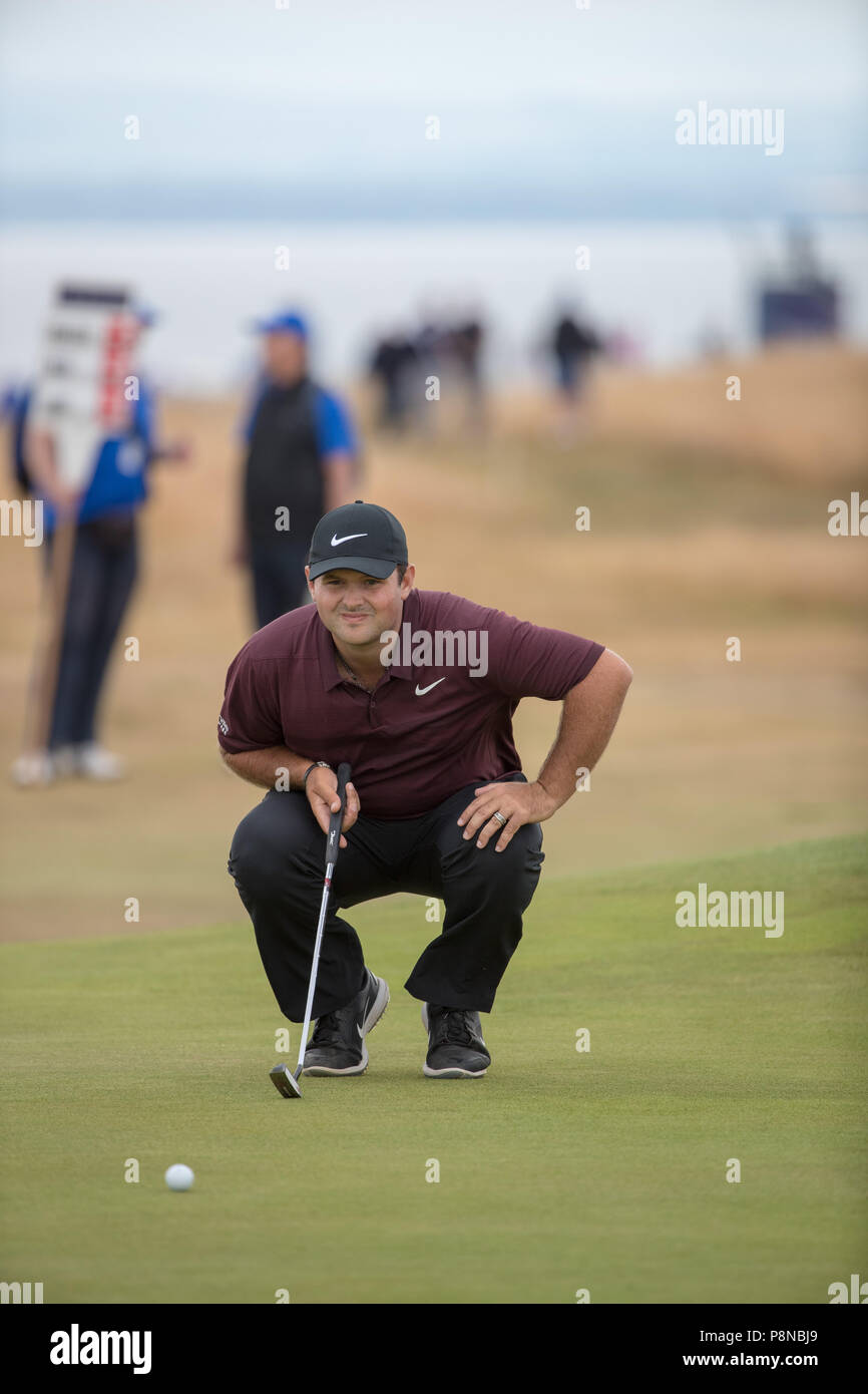 Patrick Reed lines up his birdie putt at the 16th hole during day one ...