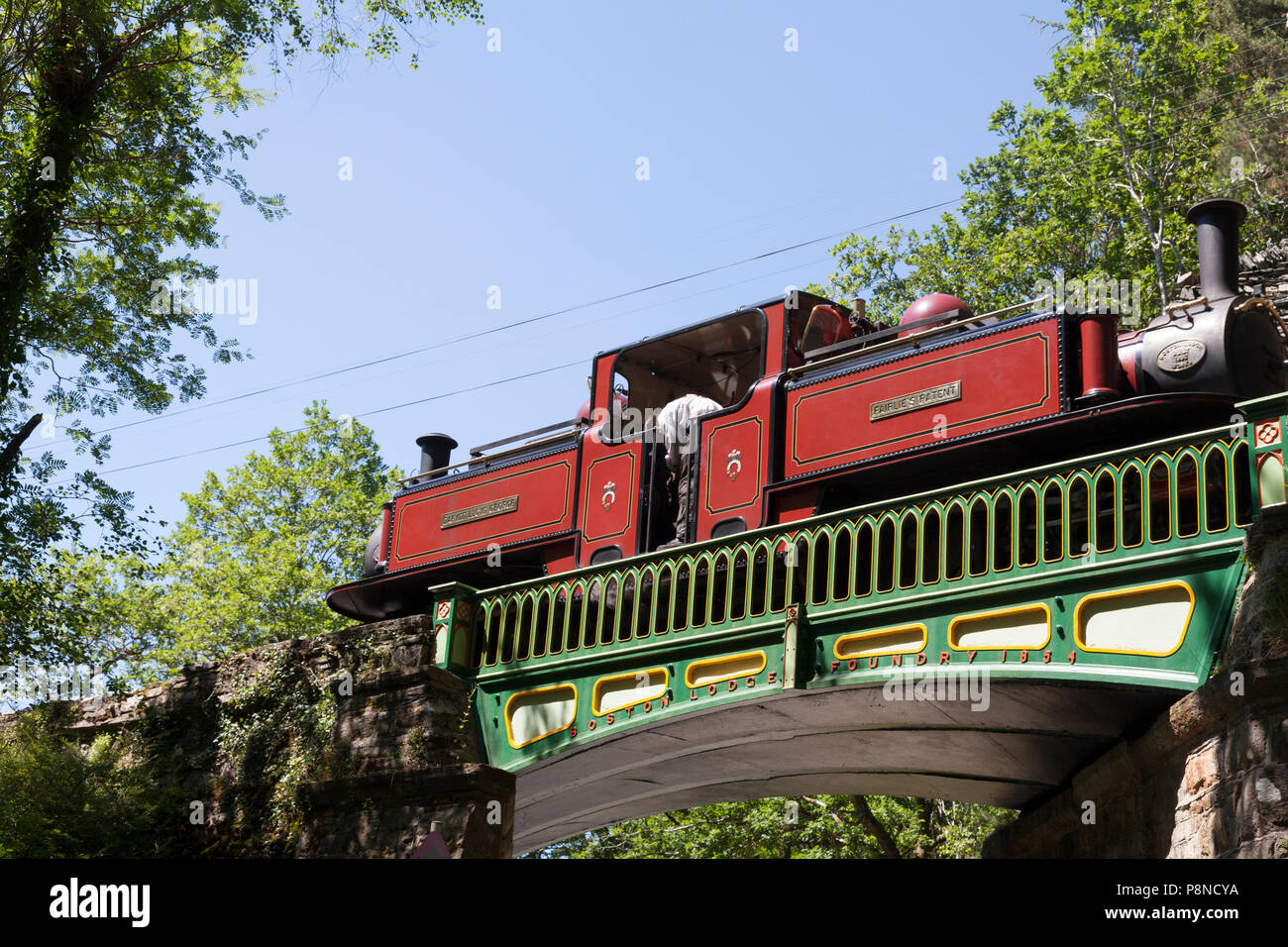 Locomotive on the Ffestiniog Railway crossing road bridge, Tan-y-Bwlch ...