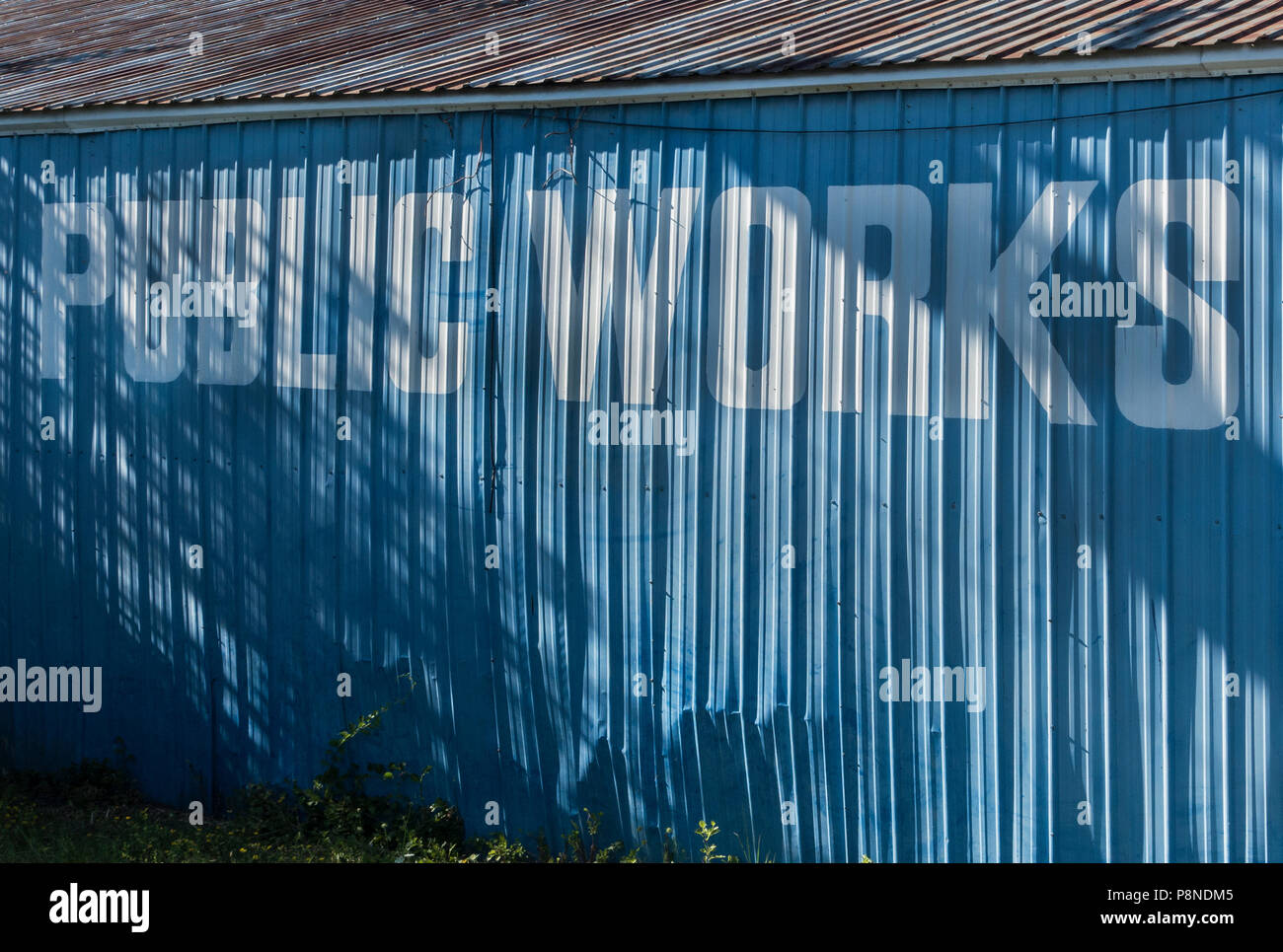 public works sign on building Stock Photo - Alamy