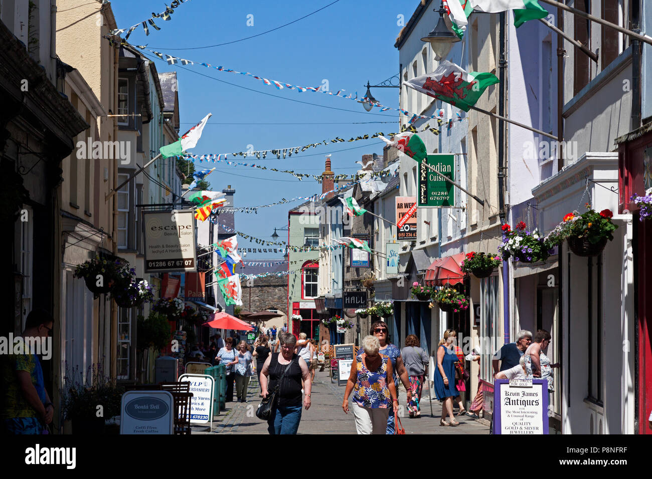 Shoppers and tourists in Palace Street, Caernarfon, Gwynedd, Wales ...