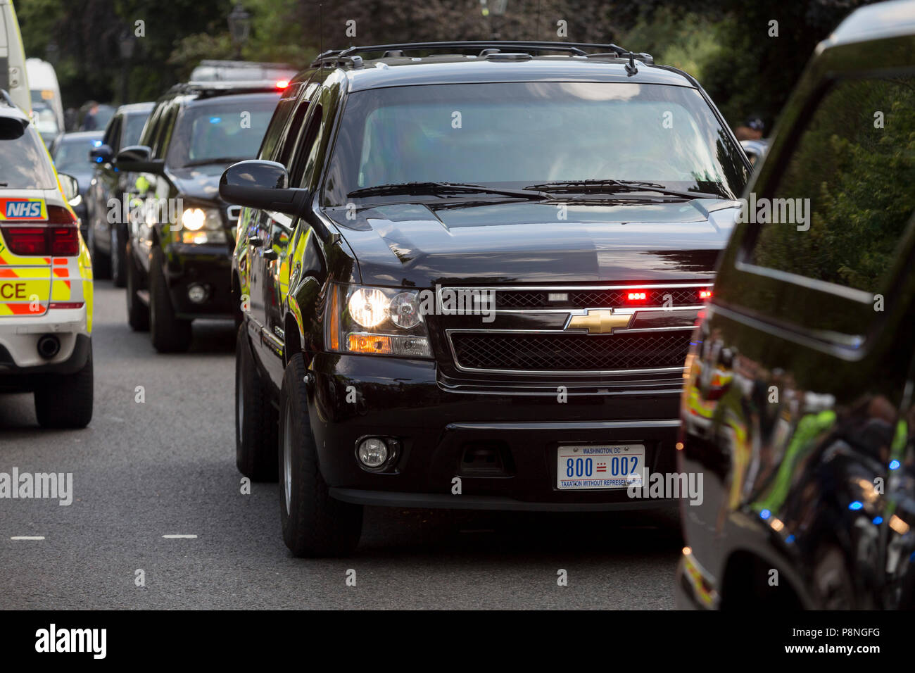 A cavalcade of official presidential vehicles approaches Winfield House ...