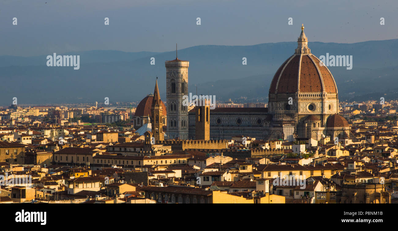The sun shines morning light on the cityscape of Florence Stock Photo ...