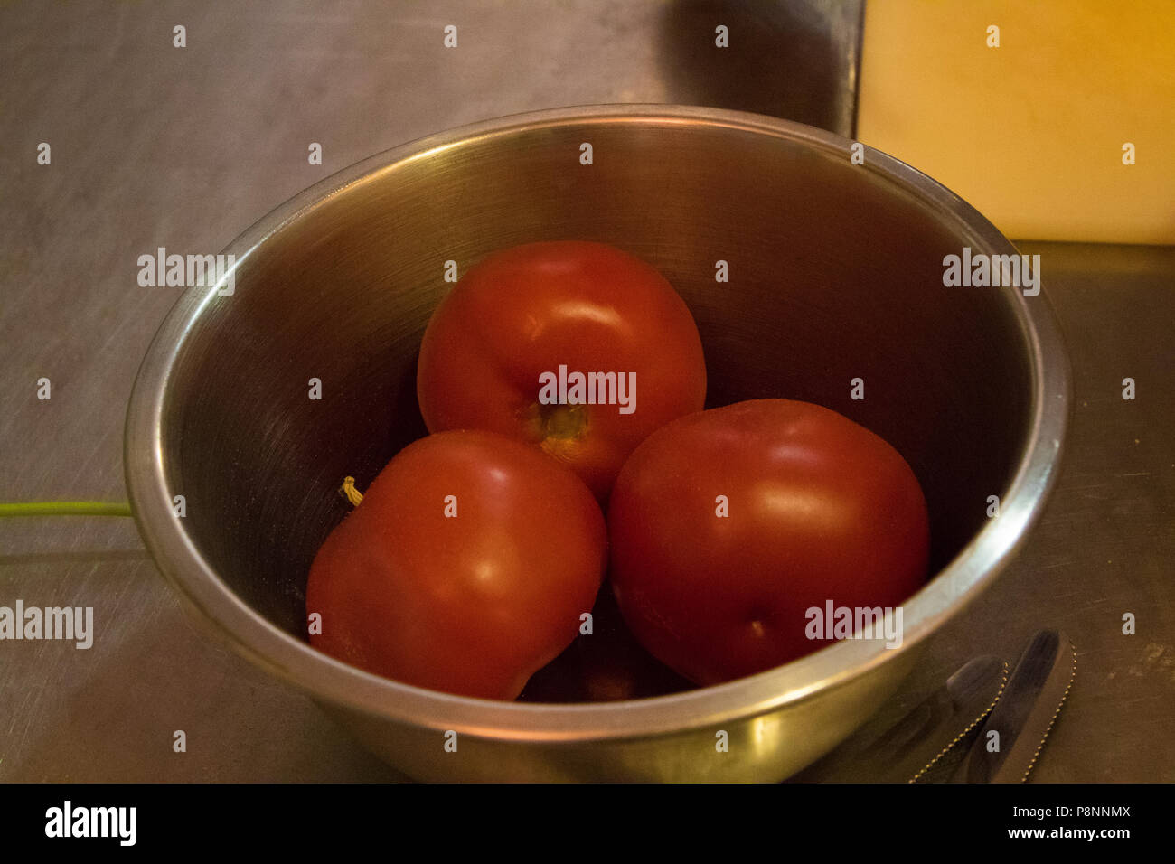 A bowl of tamatoes waiting to be chopped for Bruschetta Stock Photo - Alamy