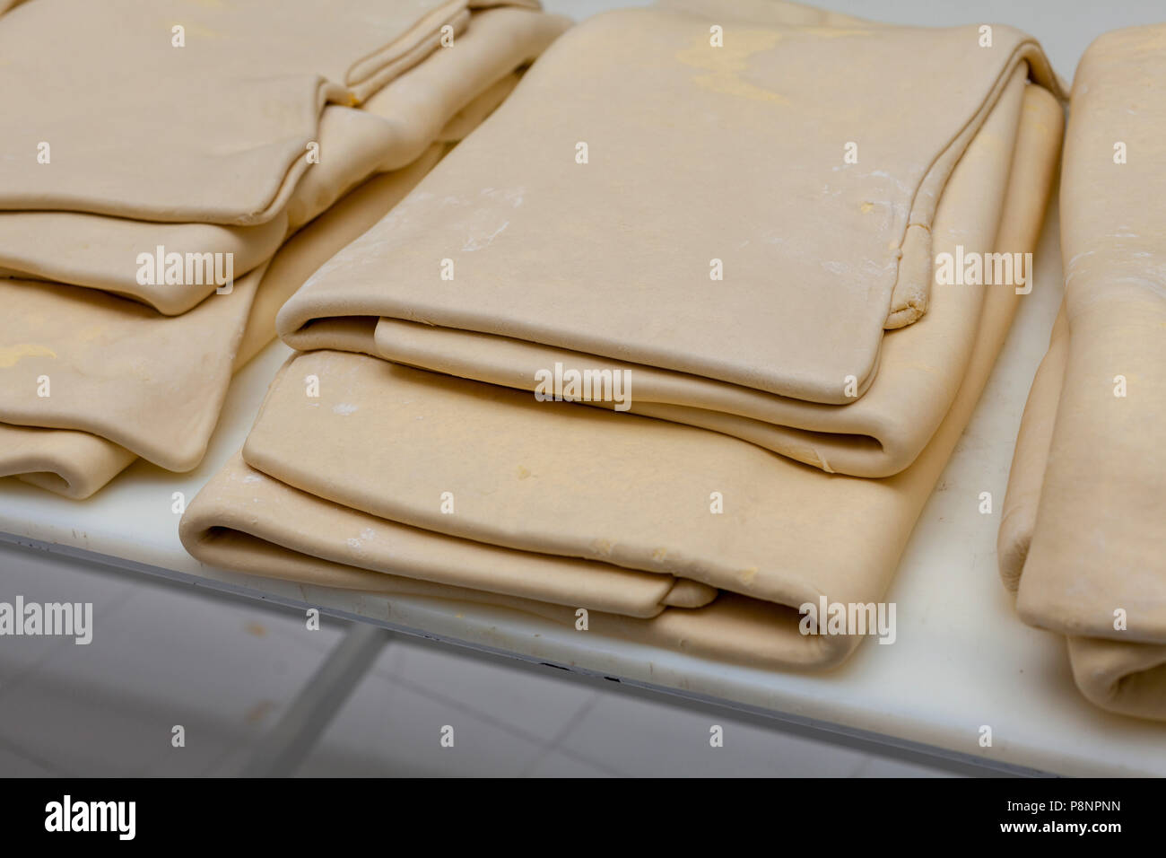 Industrial production of puff pastry Stock Photo - Alamy