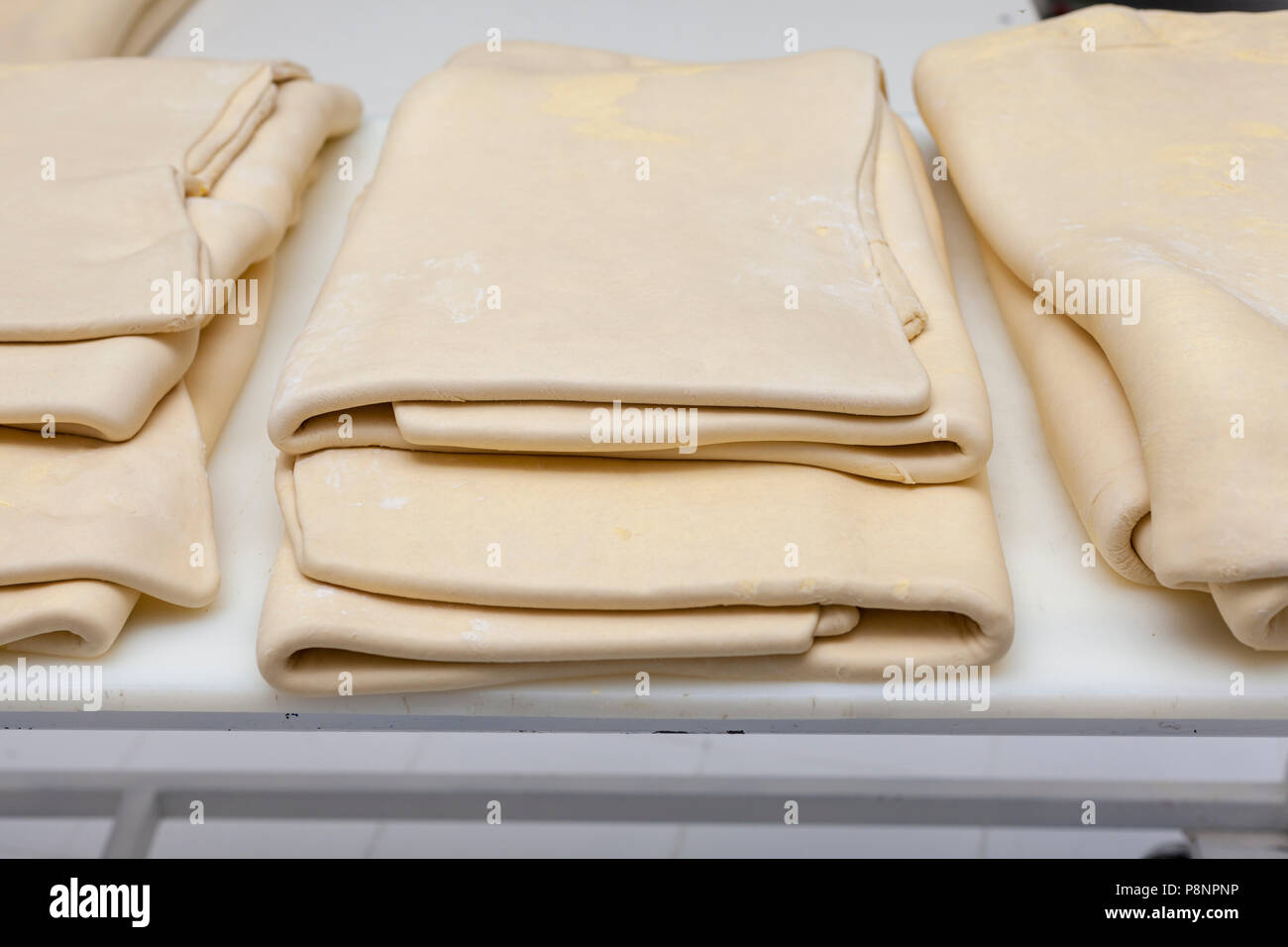 Industrial production of puff pastry Stock Photo - Alamy