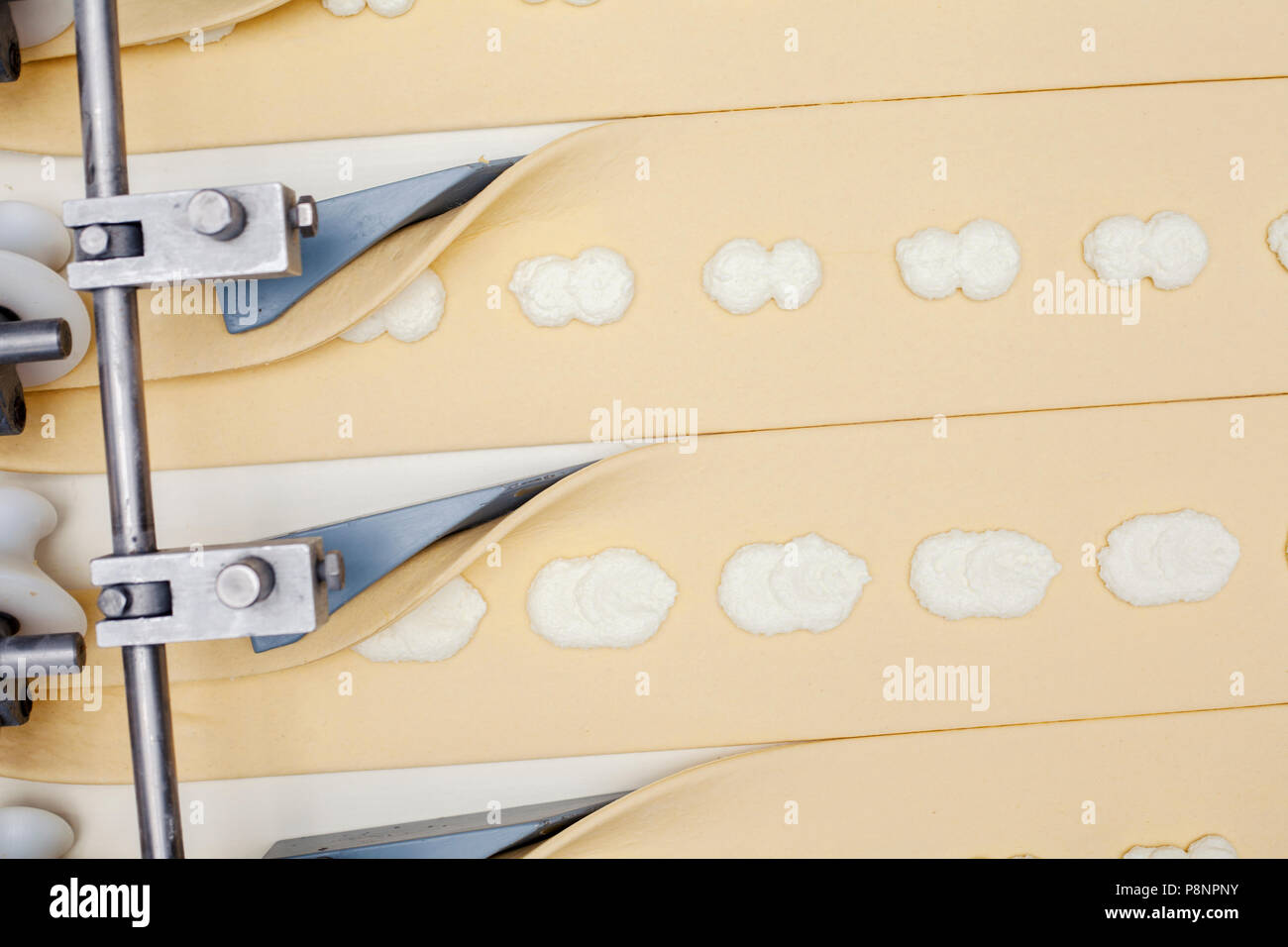 Industrial production of puff pastry Stock Photo - Alamy