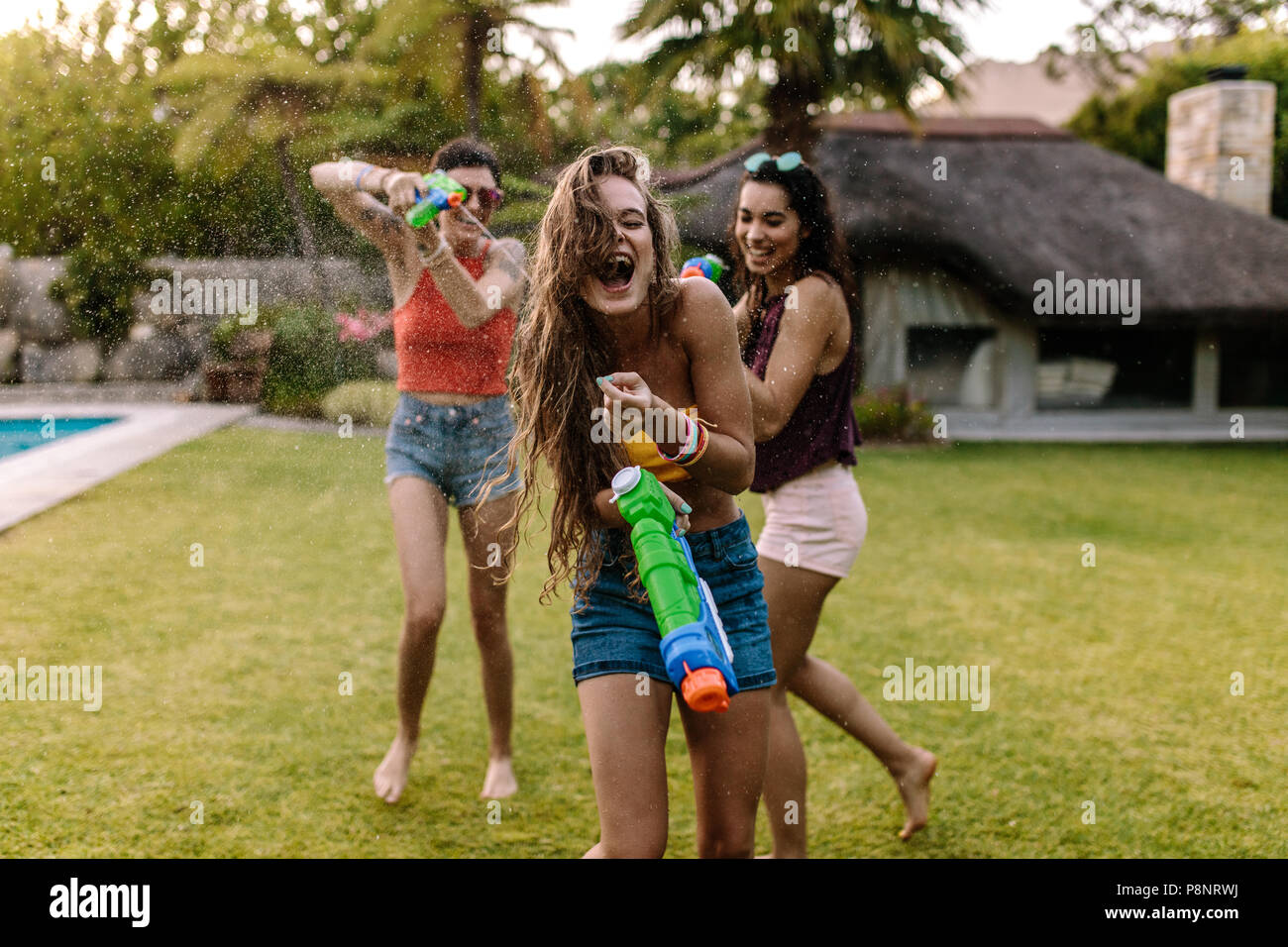 Women fighting into pool hi-res stock photography and images - Alamy