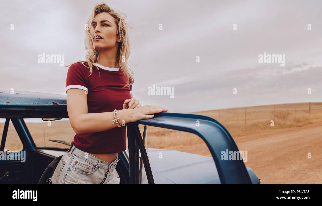 Young woman got lost in the countryside while driving a car. Female ...