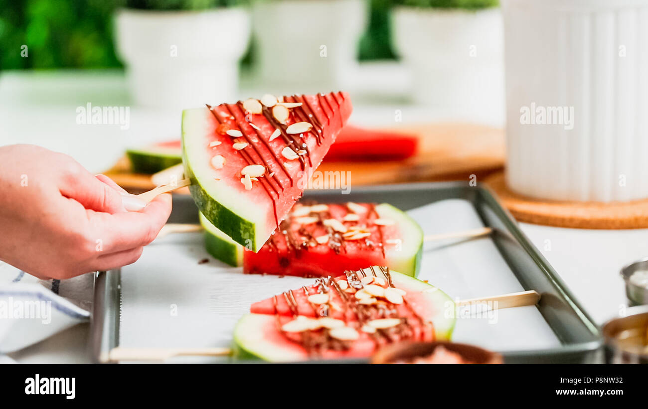 Step step watermelon wedges garnished hi-res stock photography and ...