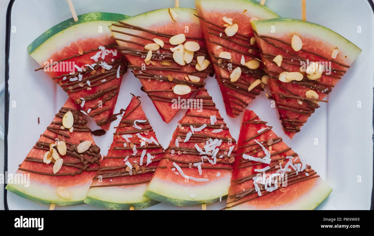 Step by step. Watermelon wedges garnished with chocolate and sea salt ...