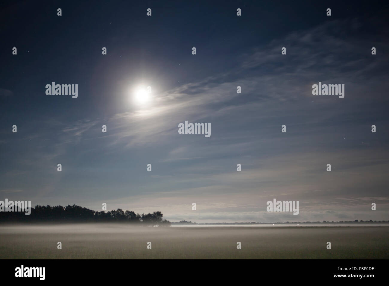 Moon dog (Paraselene) visble to the right of the full moon Stock Photo ...