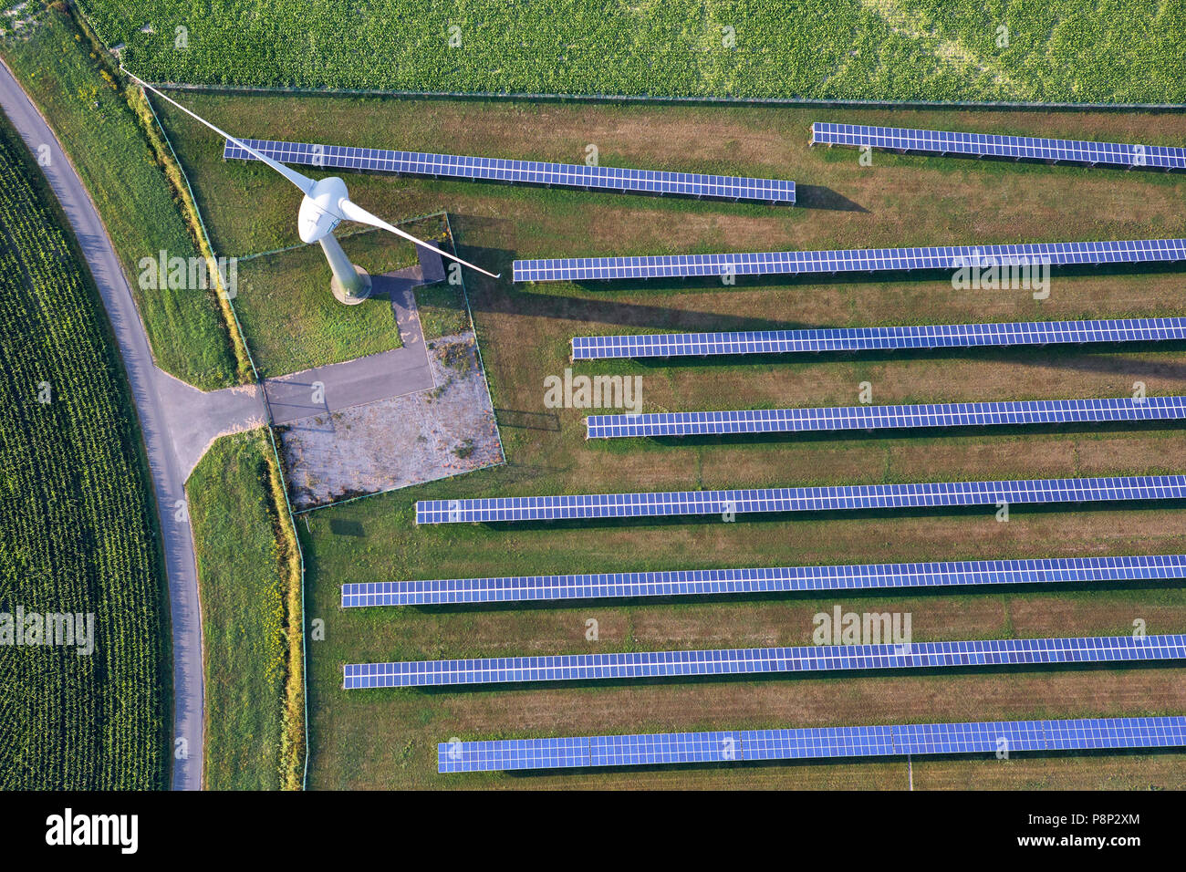 Aerial of a windmill and solar panels Stock Photo - Alamy