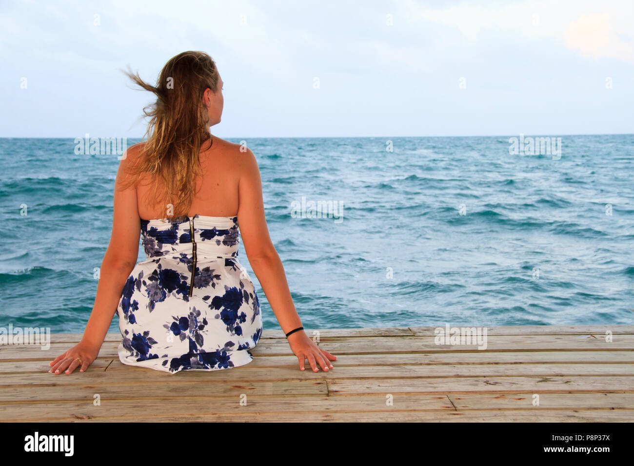 Woman looking out ocean waves hi-res stock photography and images - Alamy