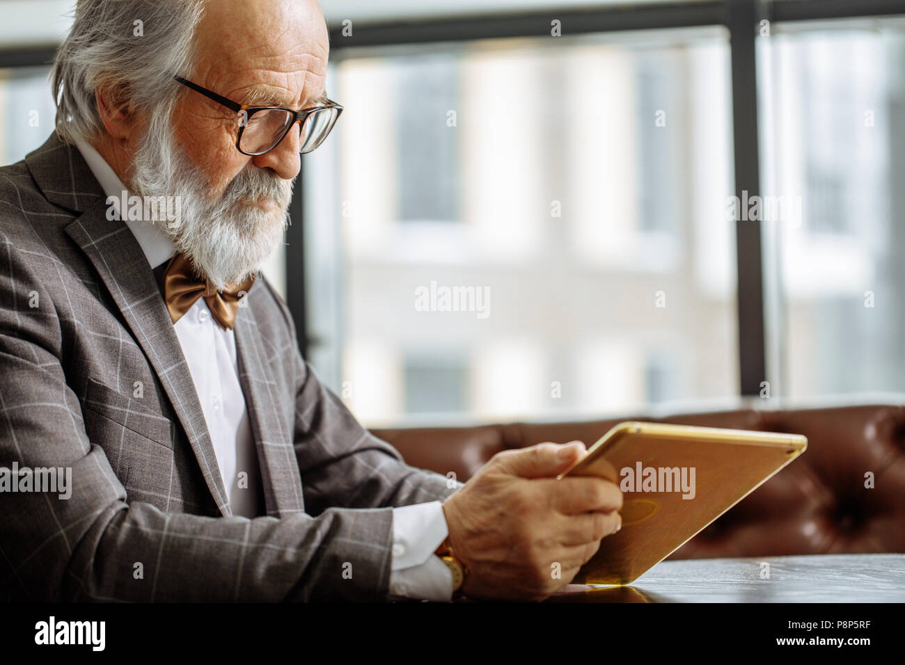 old professor is making up the tests for students. using gadget in ...