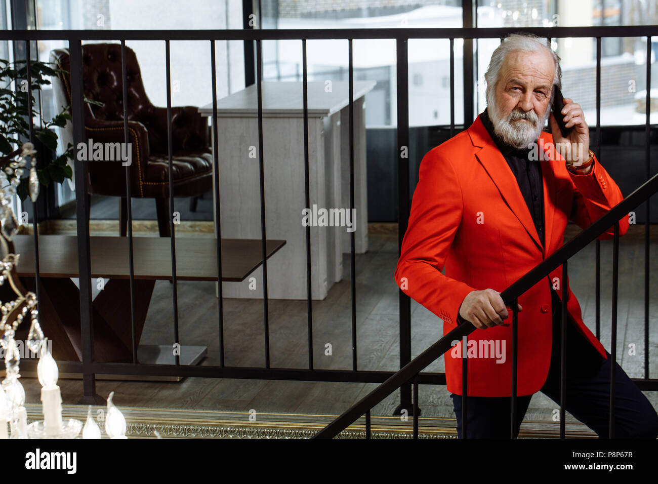 old mobster in stylish clothes is making a phone call. old mafia making ...