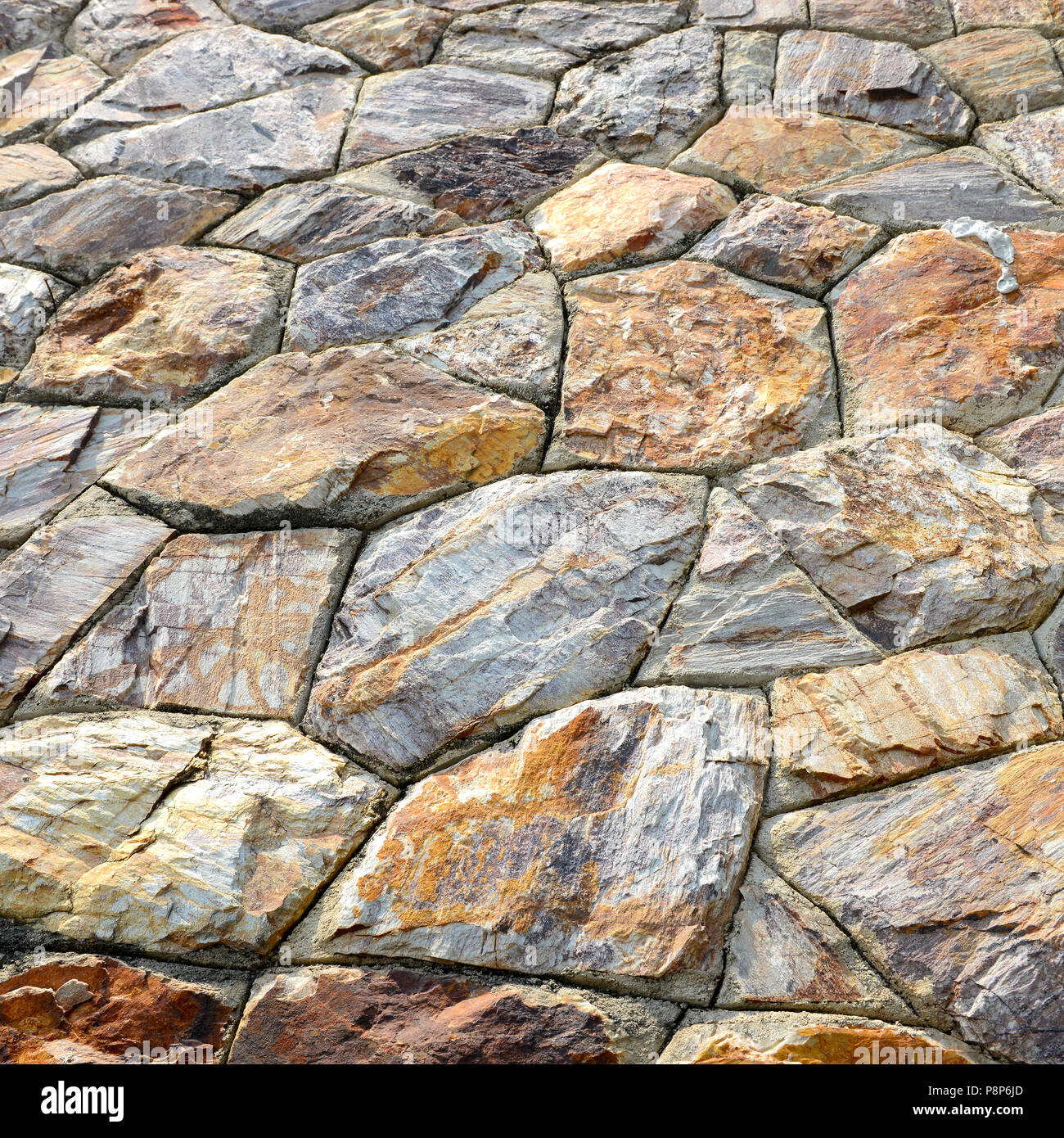 Brown stone wall texture and background Stock Photo - Alamy
