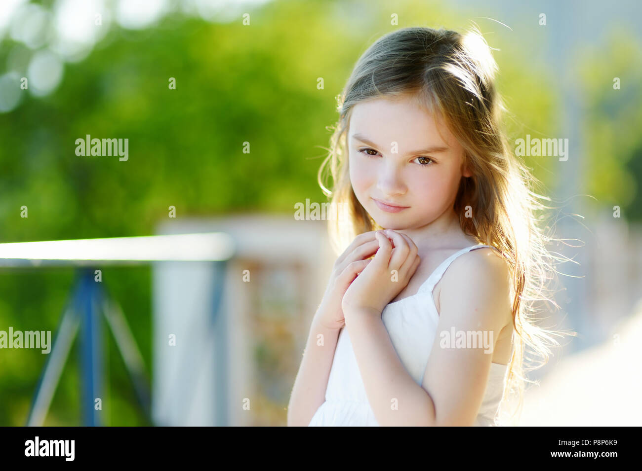 Adorable little girl on warm and sunny summer day Stock Photo - Alamy