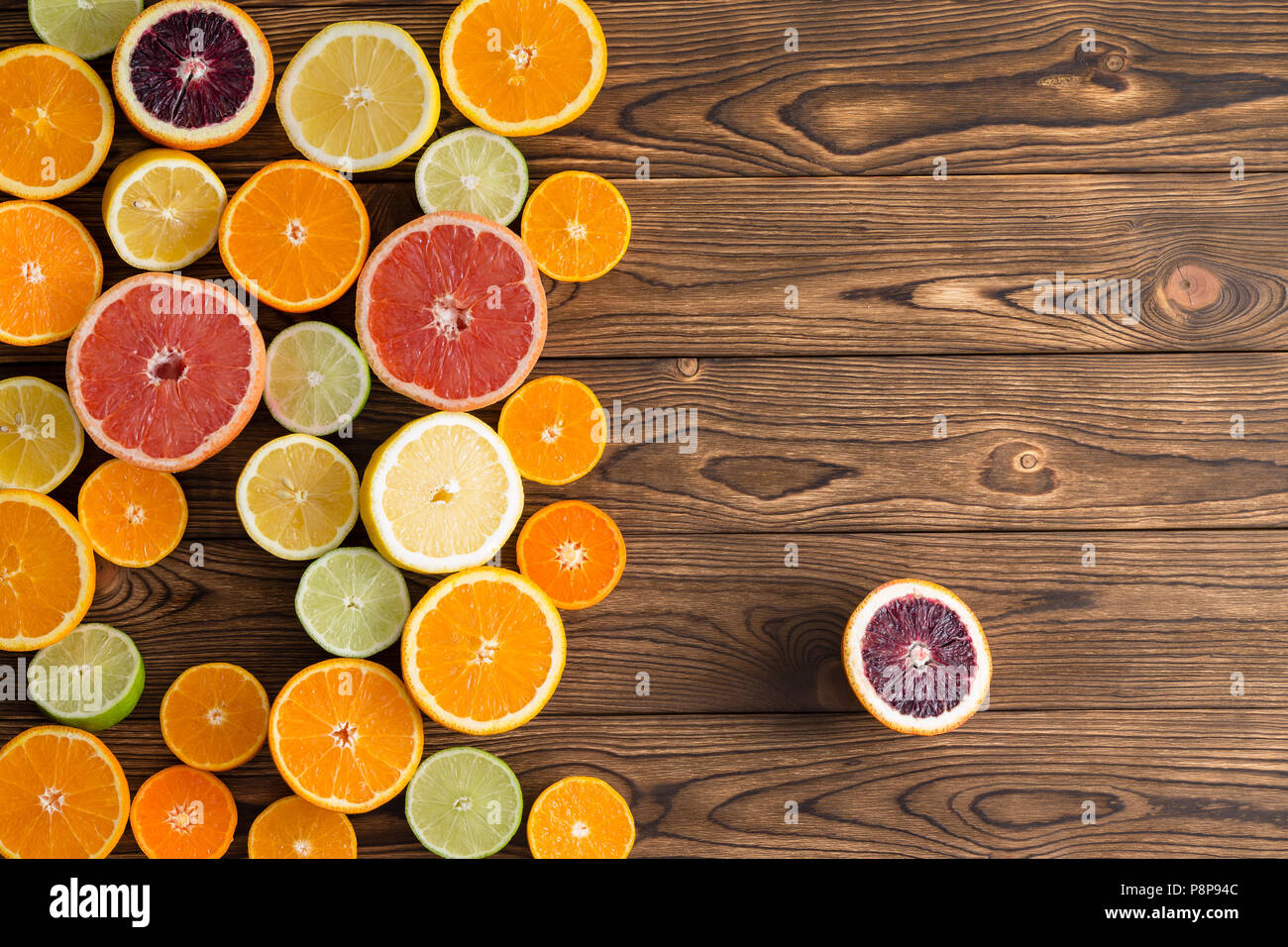 Colorful display of a variety of cut citrus fruits with oranges ...