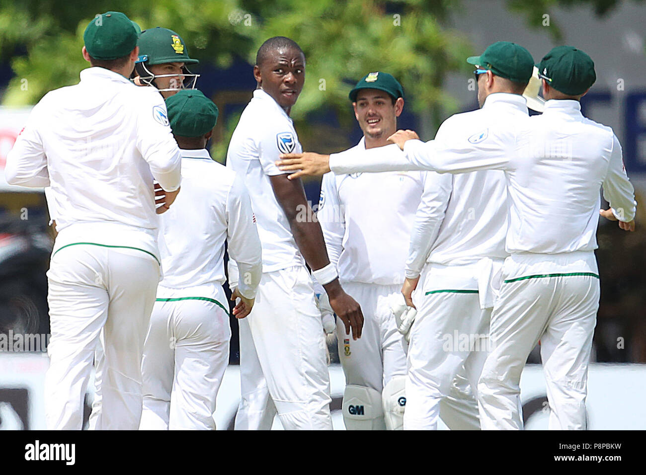 South African fast bowler Kagiso Rabada (C) celebrating the wicket with ...