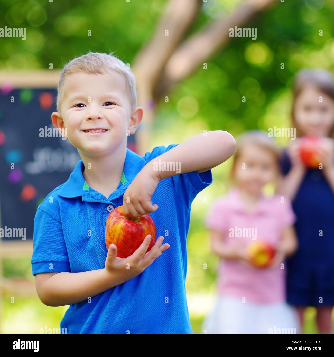 Adorable little boy feeling extremely excited about going back to ...