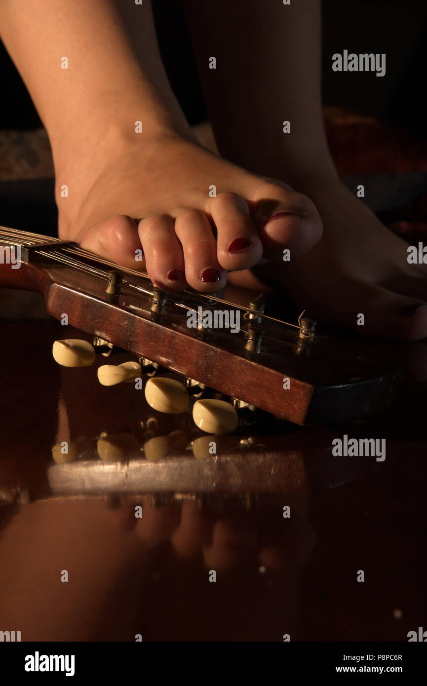 lady foot on mandolina Stock Photo - Alamy