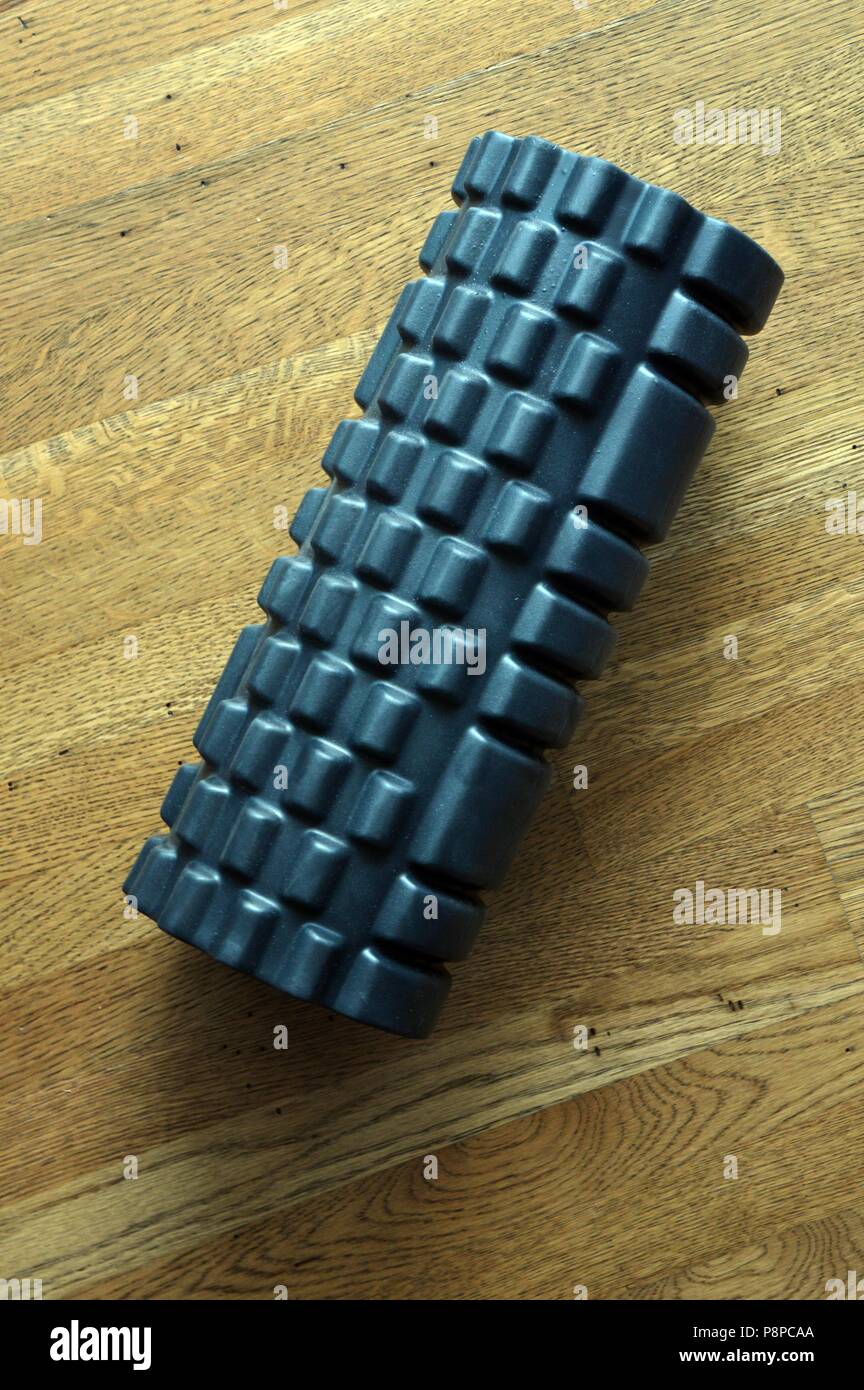 foam roller on wooden floor Stock Photo - Alamy