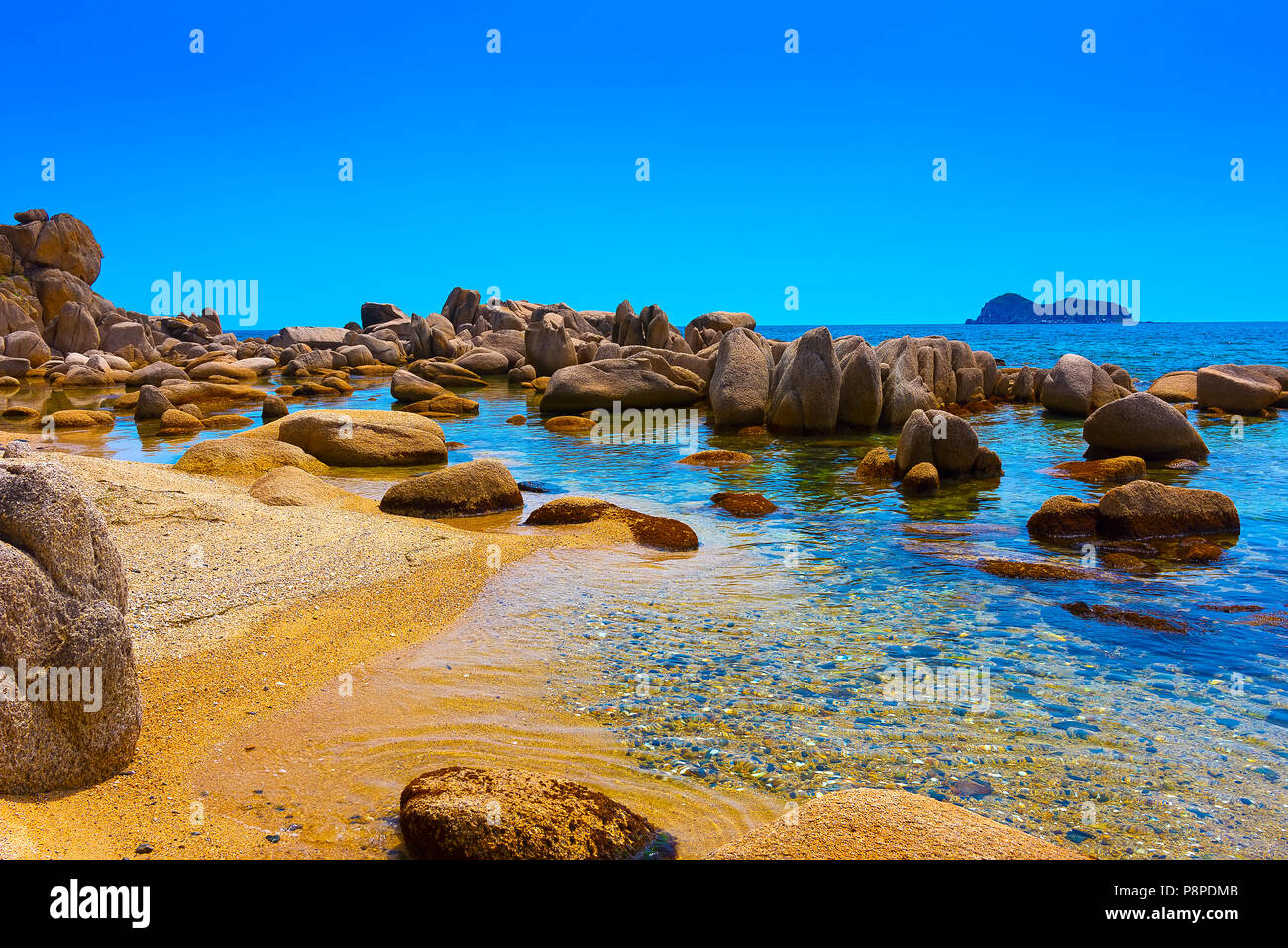 Waves of the Pacific Ocean on the rocks. Sand on the seashore. Wild ...