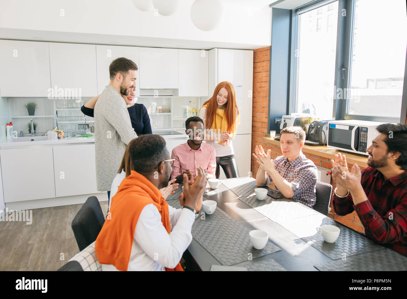 close up side view photo of students congratulating their African mate ...