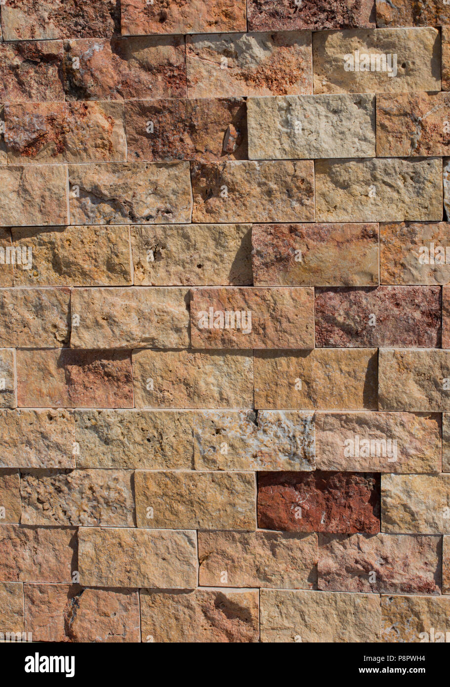 Decorative cubic stone wall as background texture Stock Photo - Alamy
