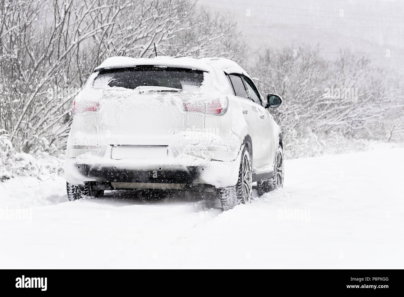 Blizzard. Car in the snow. Winter road after snowfall Stock Photo - Alamy