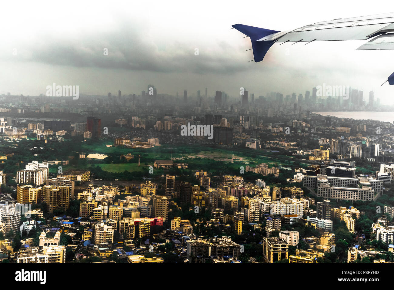 Metro City view from the window of an aeroplane in rainy season with ...