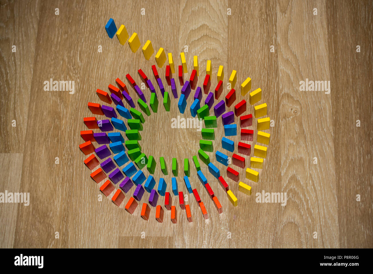 Colorful Domino Blocks in a line on a white background Stock Photo - Alamy