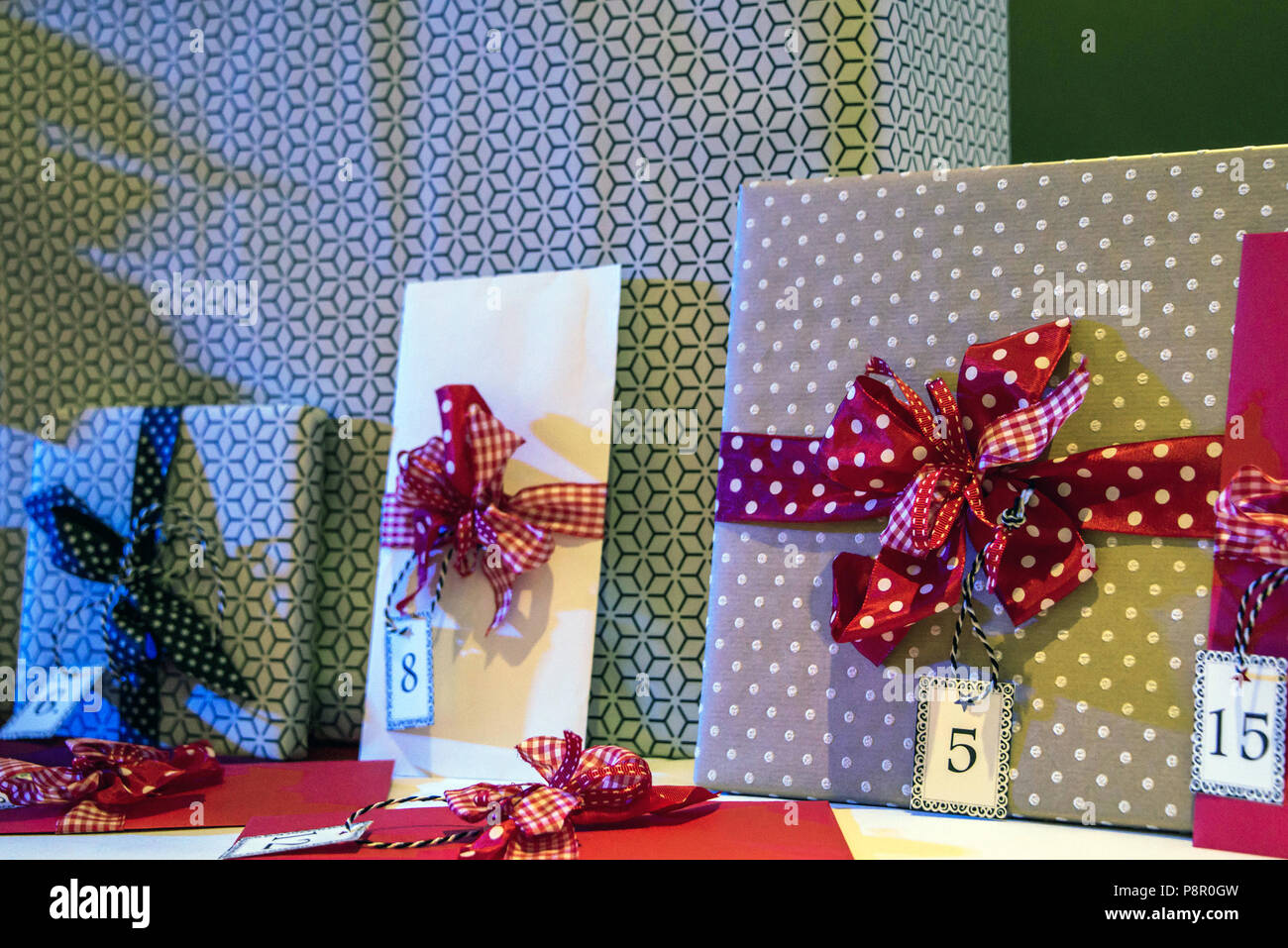 view of various gift boxes on wooden table numbered for a christmas ...