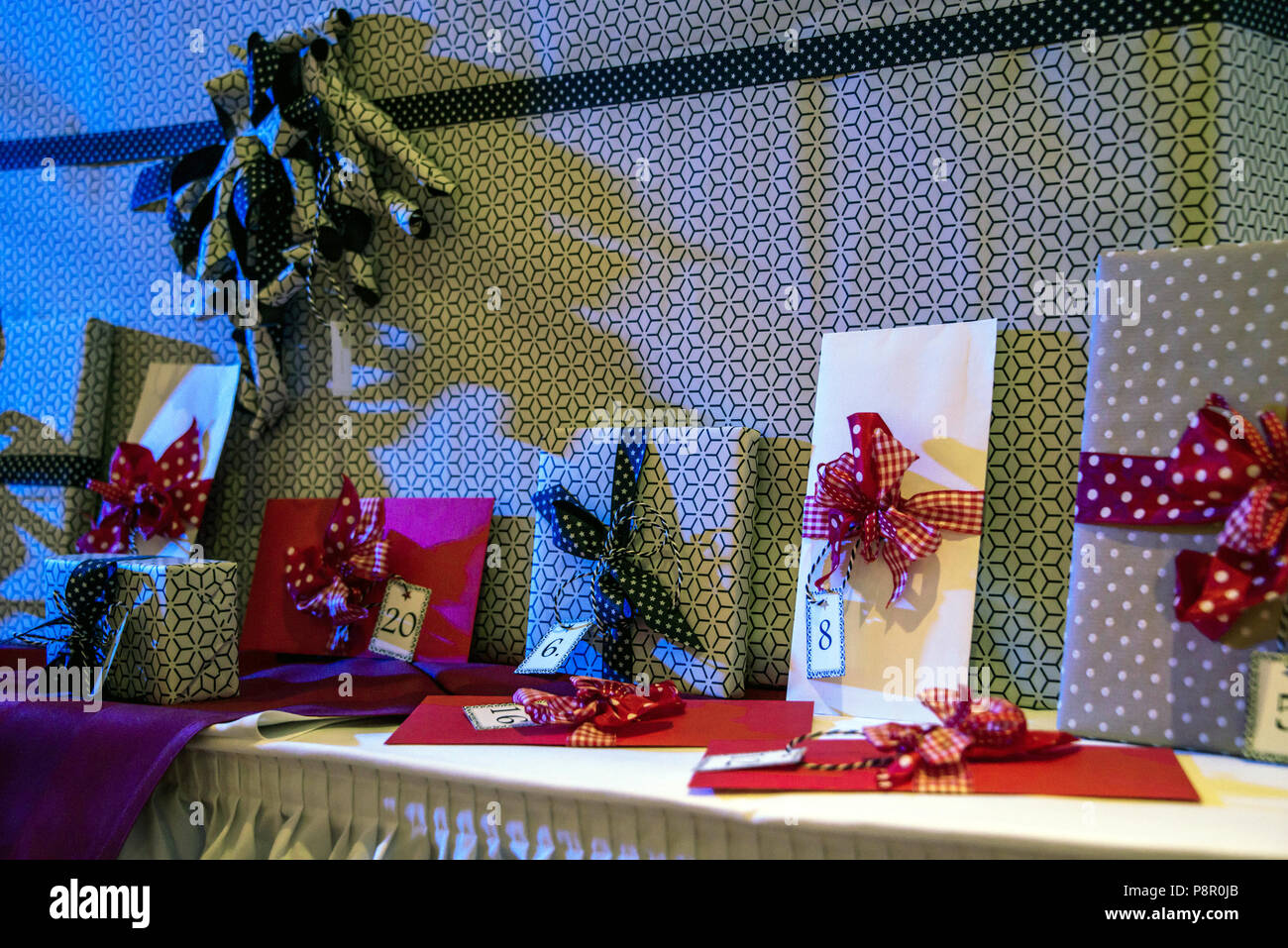 view of various gift boxes on wooden table numbered for a christmas ...