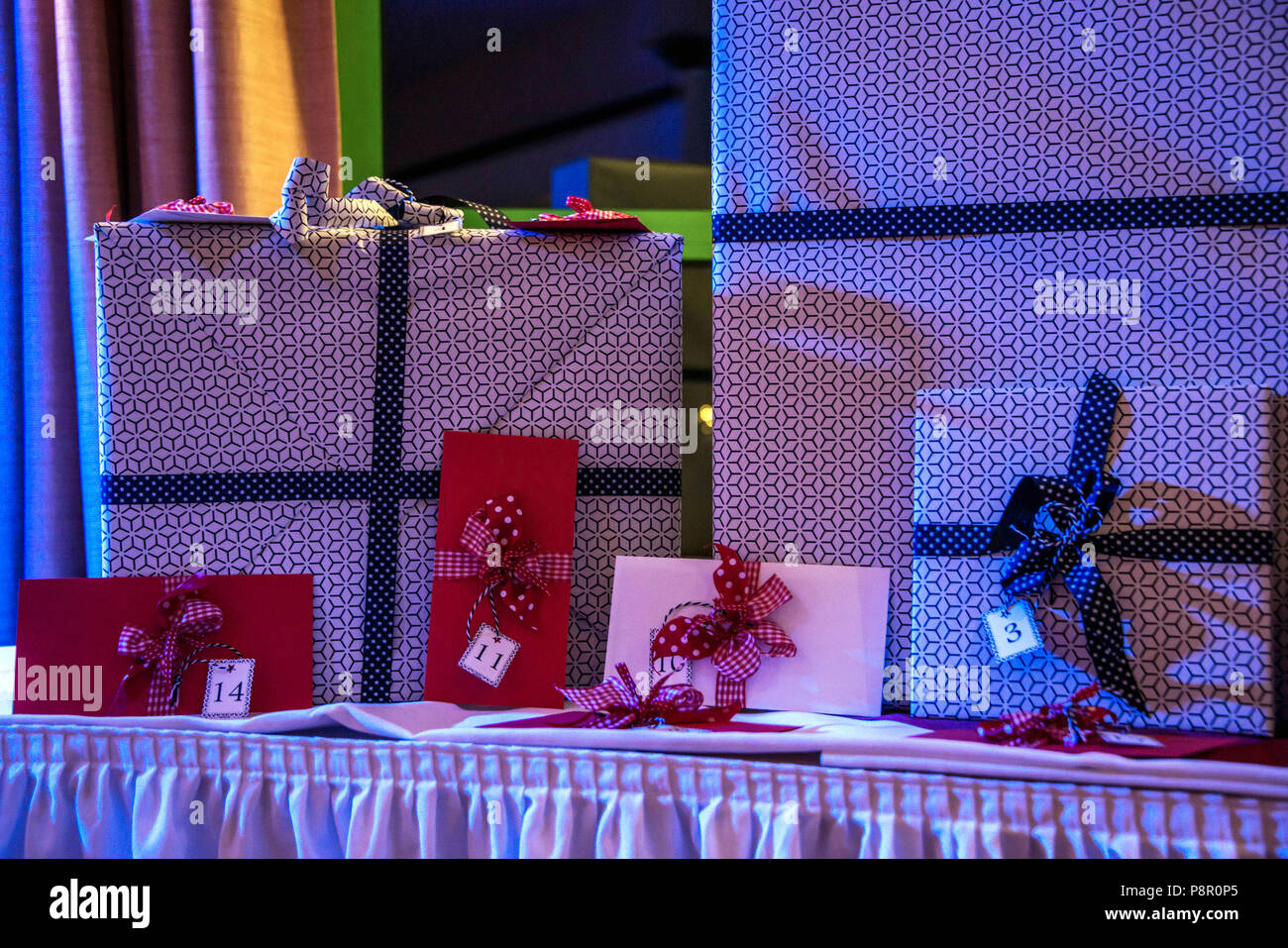 view of various gift boxes on wooden table numbered for a christmas ...