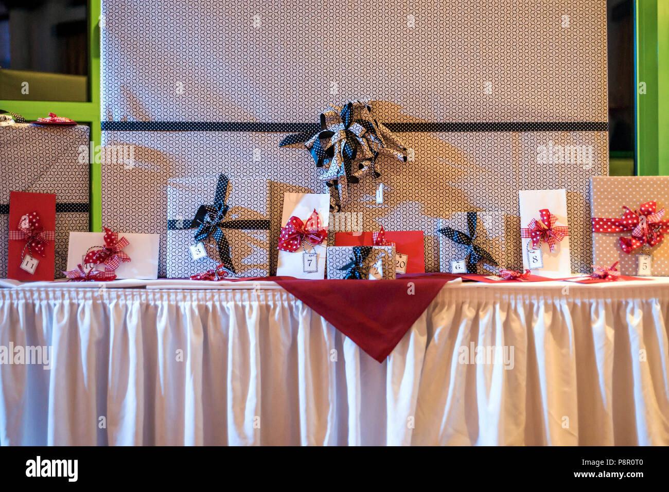 view of various gift boxes on wooden table numbered for a christmas ...
