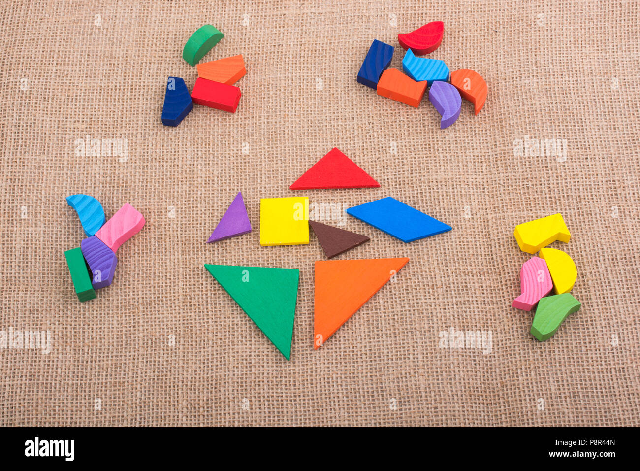 Colorful pieces of a square tangram puzzle Stock Photo - Alamy