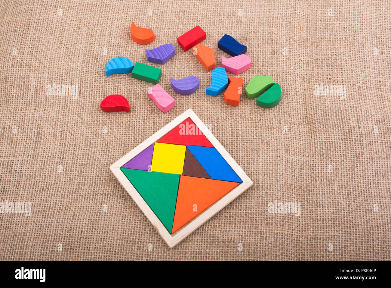 Colorful pieces of a square tangram puzzle Stock Photo - Alamy