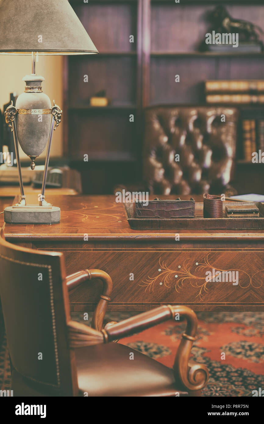 Rich vintage house with leather interior and a lamp on the table Stock ...