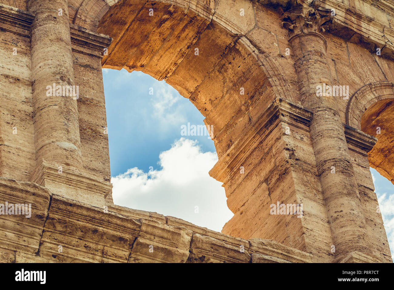 Coliseum in Rome, Italy. Architectural details on a facade. The blue ...