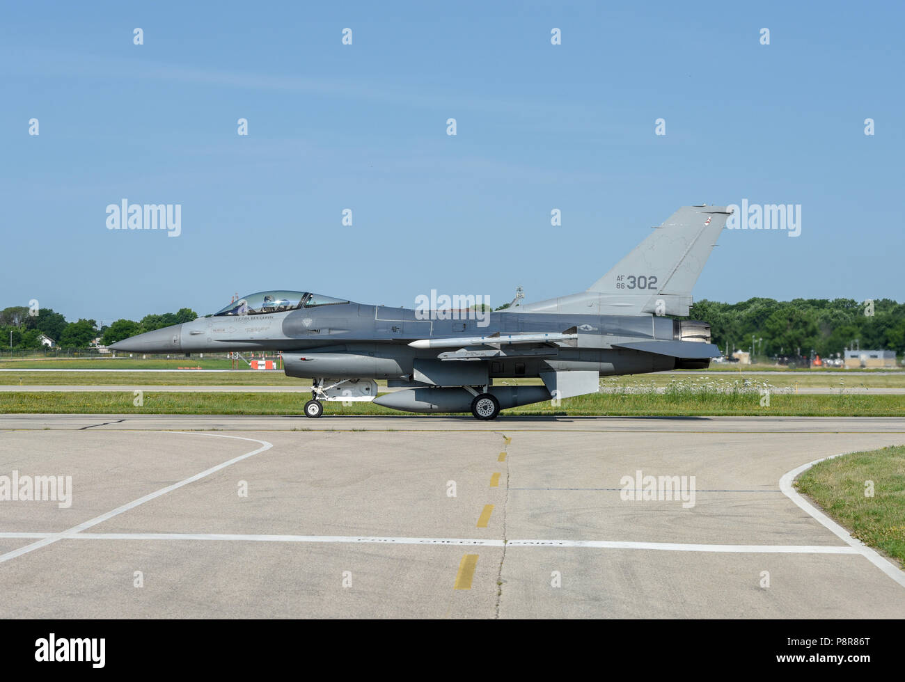 An F-16 Fighting Falcon taxis to the runway in preparation for takeoff ...
