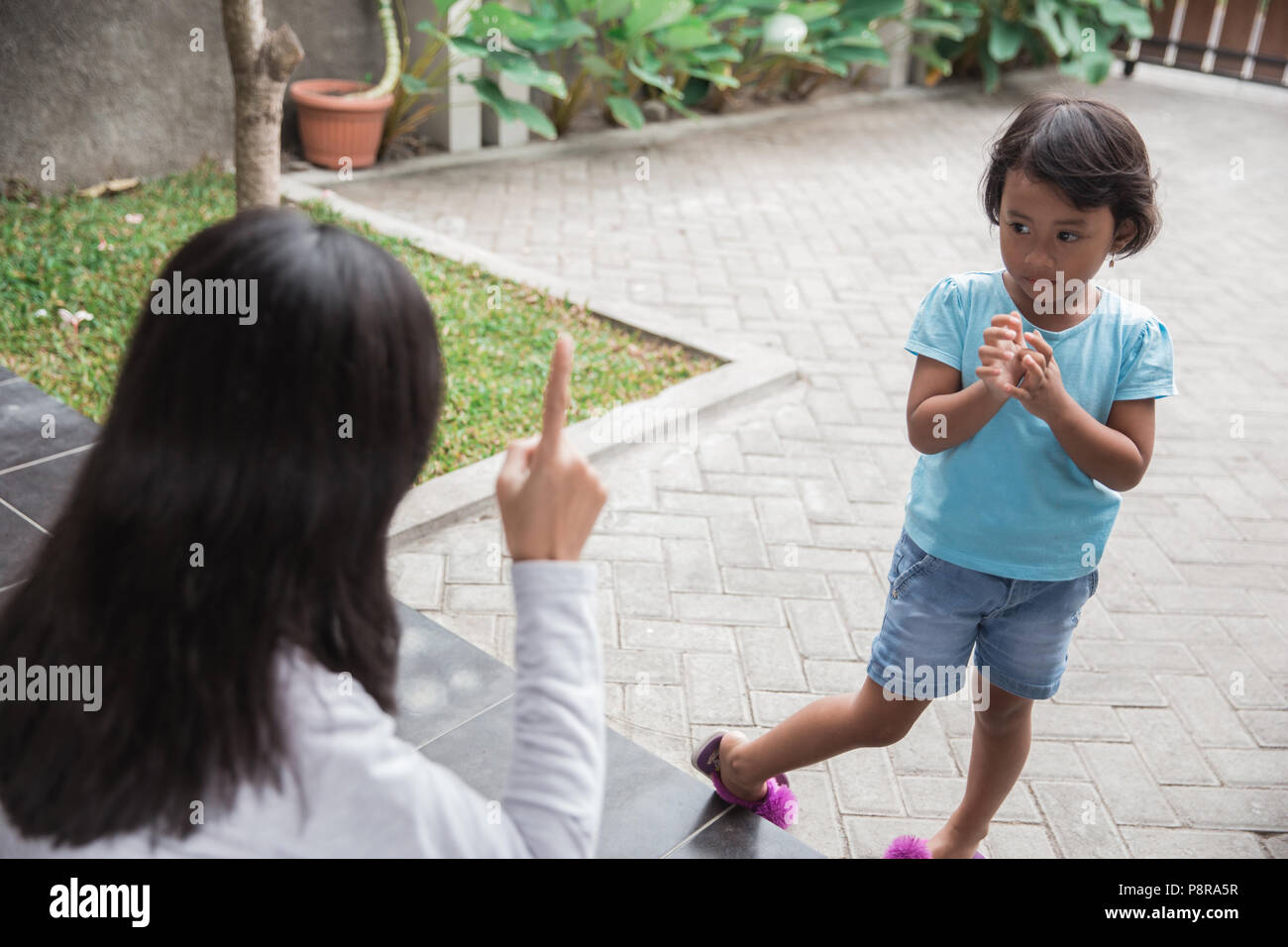 Portrait of asian mother scolding to her daughter Stock Photo - Alamy