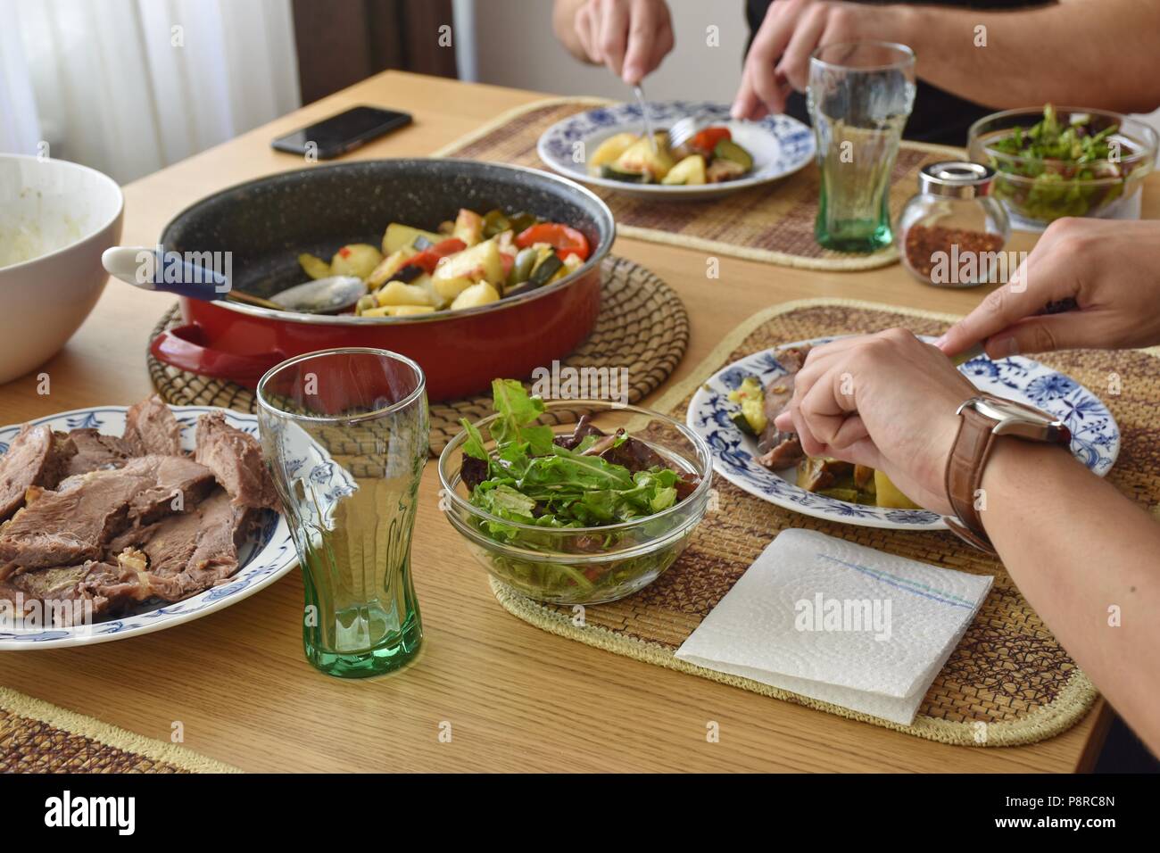 At the table Stock Photo - Alamy