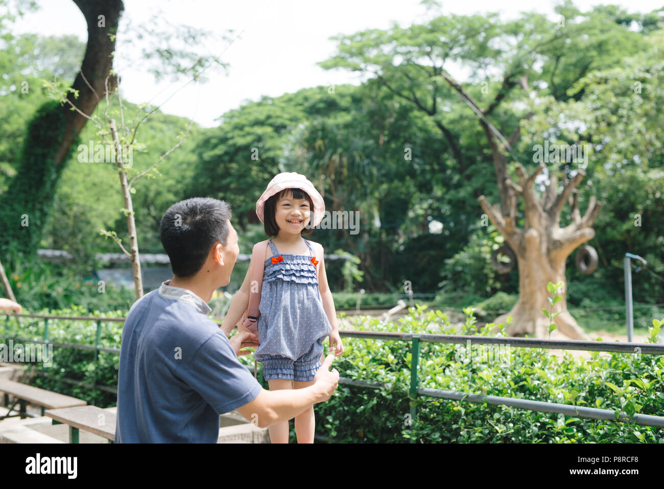 Happy family having fun with animals safari park on warm summer day ...