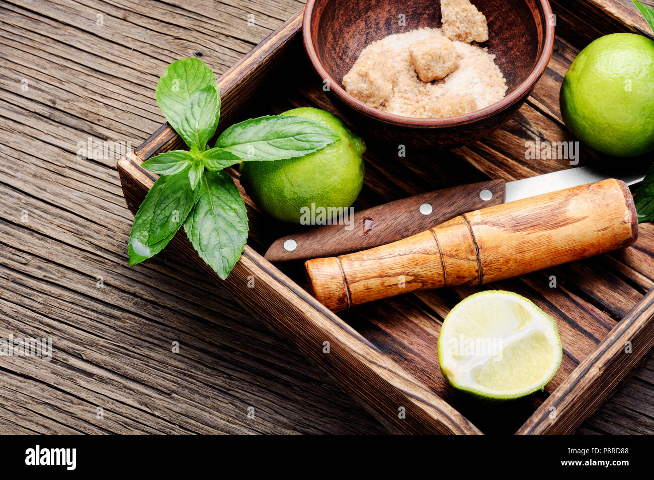 Mojito ingredients. Lime, mint and cane suga Stock Photo - Alamy