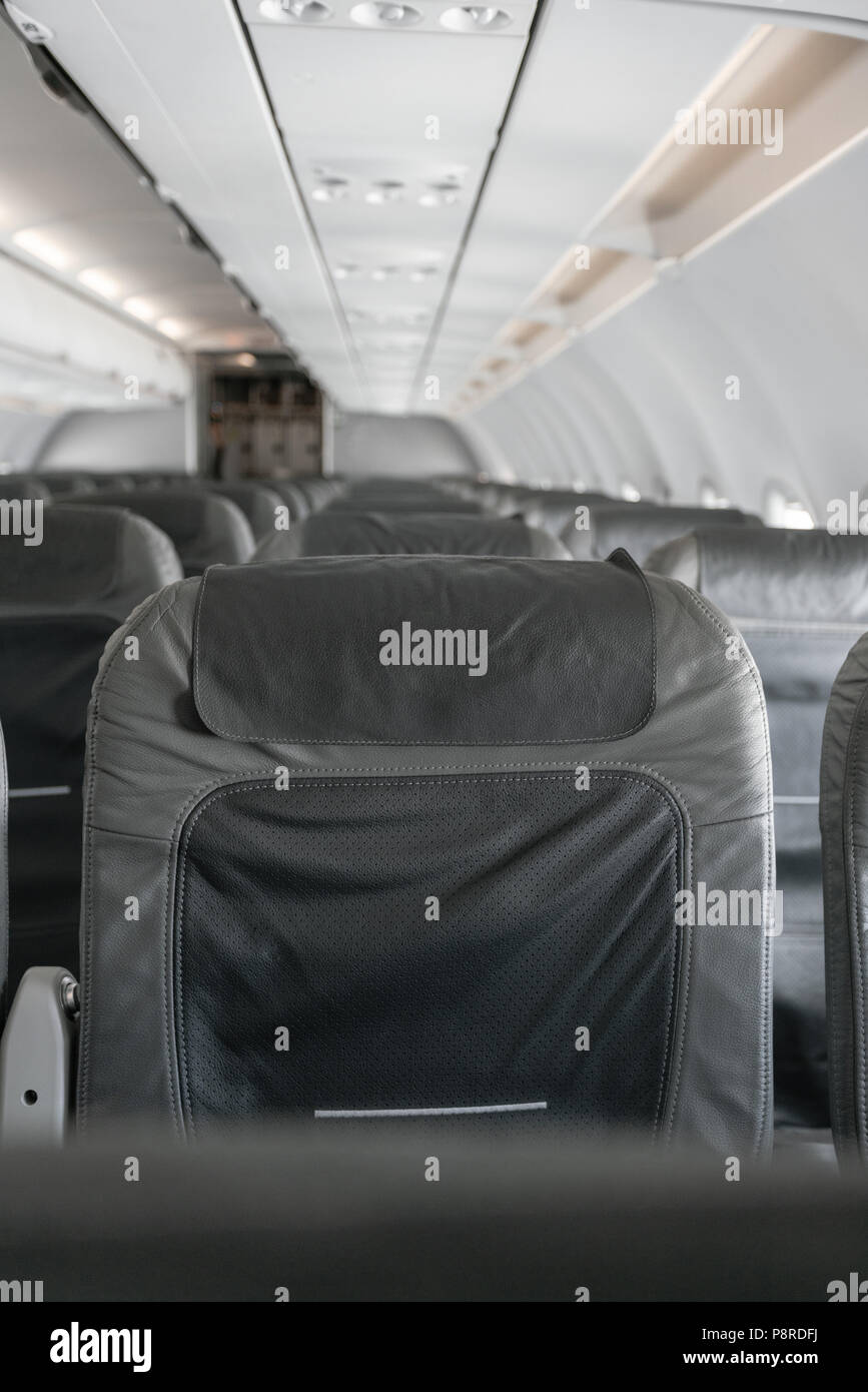 Empty airplane seats in the cabin. Modern Airplane seats in perspective ...